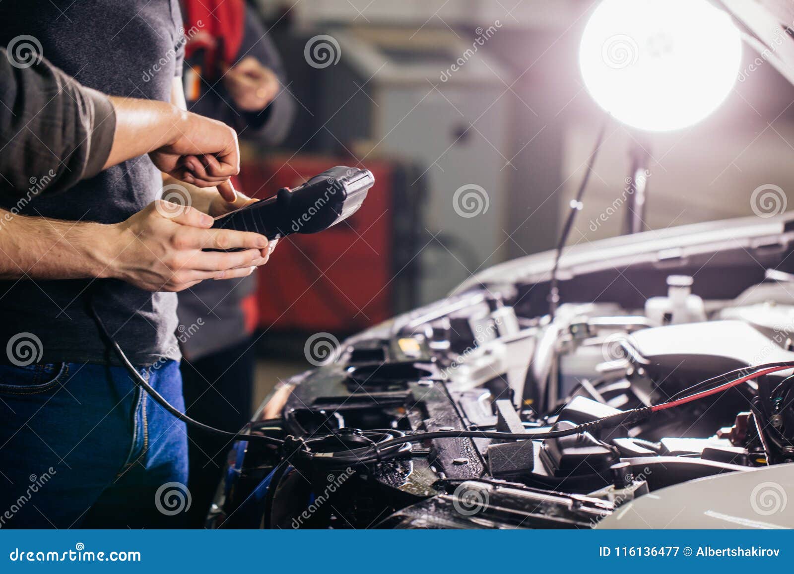Mechanic Testing Electrical System on Automobile Stock Image - Image of ...