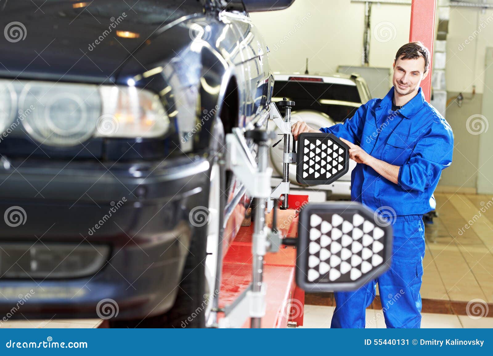 Car Mechanic at Wheel Alignment with Computer Stock Image - Image of ...