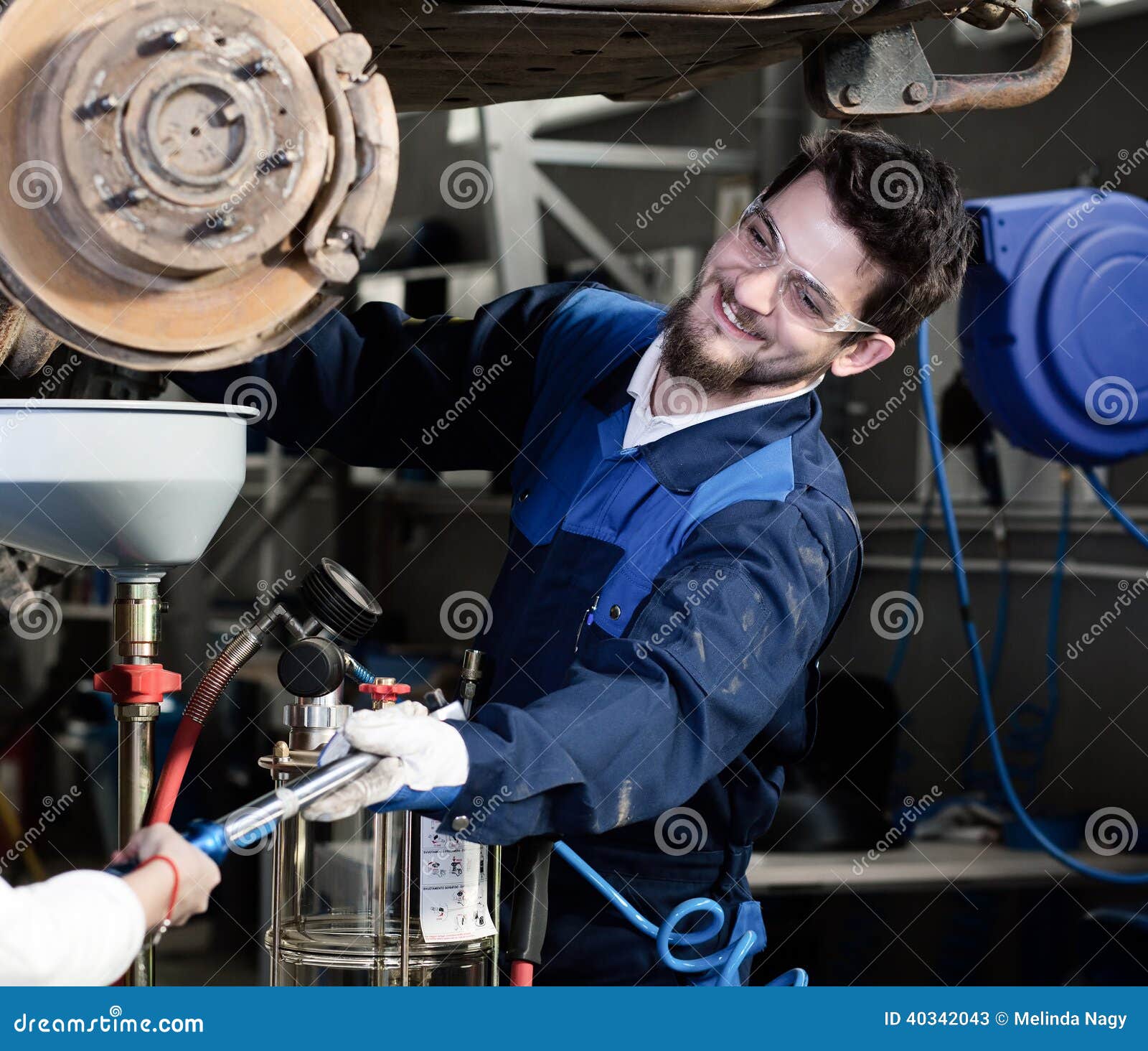 Car mechanic at work stock image. Image of adult, looking - 40342043
