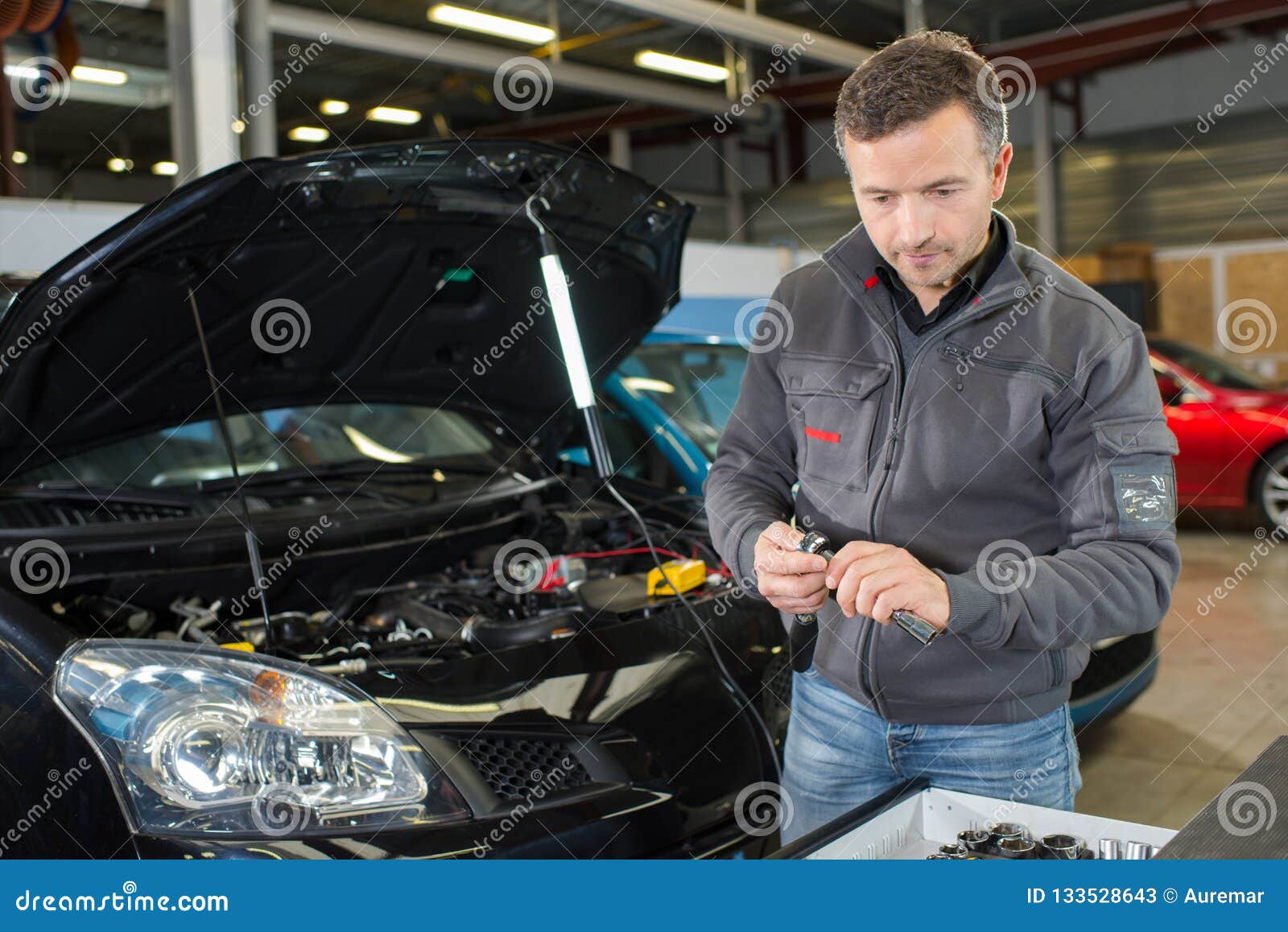 Car Mechanic Working with Tool in Service Workshop Stock Image - Image ...