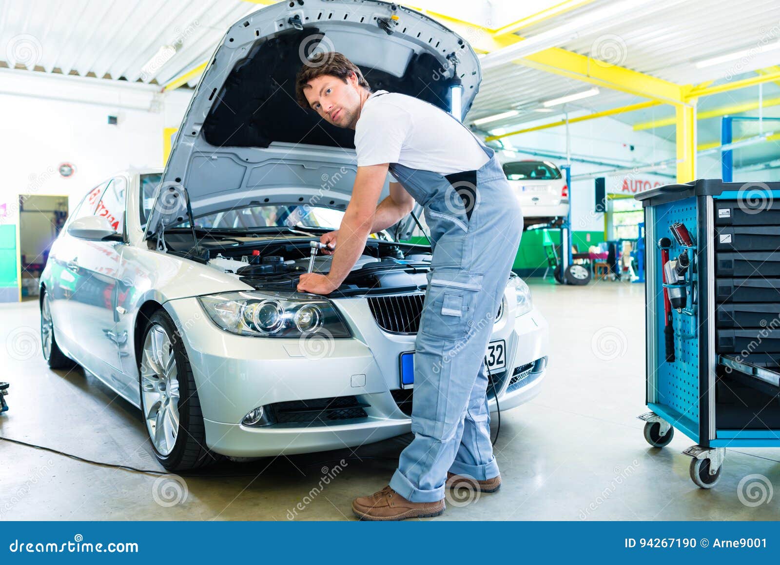 Car Mechanic Working with Tool in Service Workshop Stock Photo - Image ...