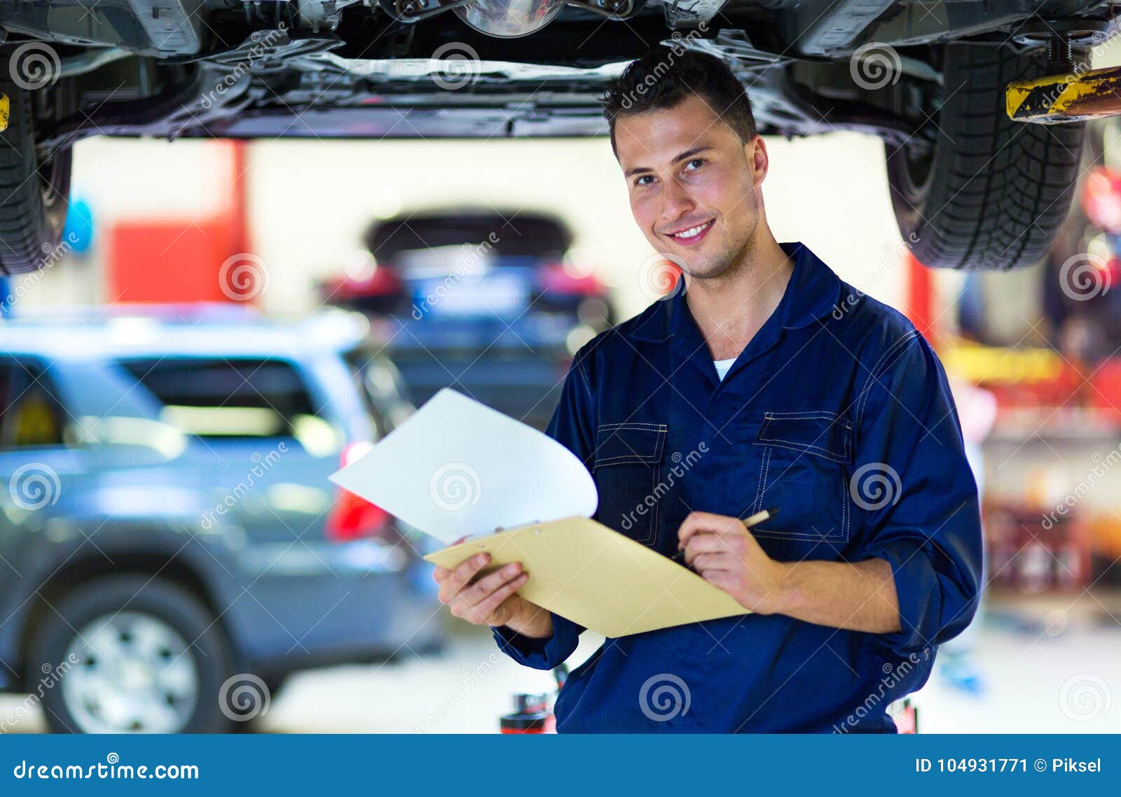 Car Mechanic Working on the Underside of a Car Stock Image - Image of ...