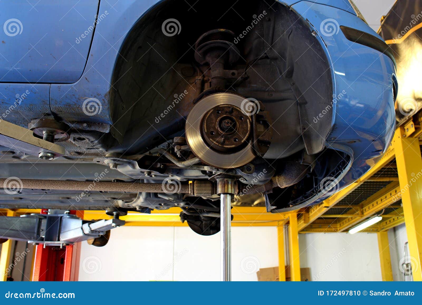 Car in the Workshop on a Mechanical Bridge Stock Photo - Image of motor ...