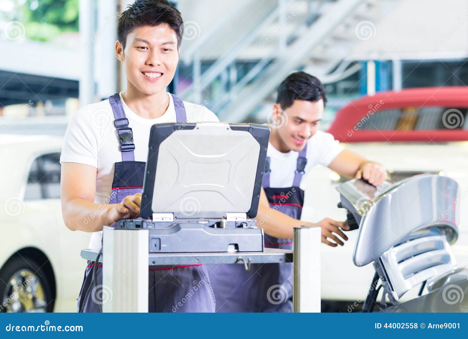 Car Mechanics with Diagnosis Tool in Asian Auto Workshop Stock Photo ...