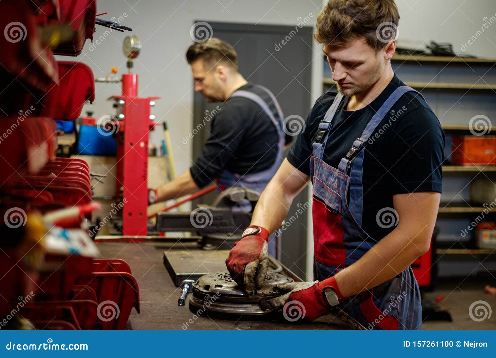Car Mechanics Inspecting Headlights in a Workshop Stock Photo - Image ...