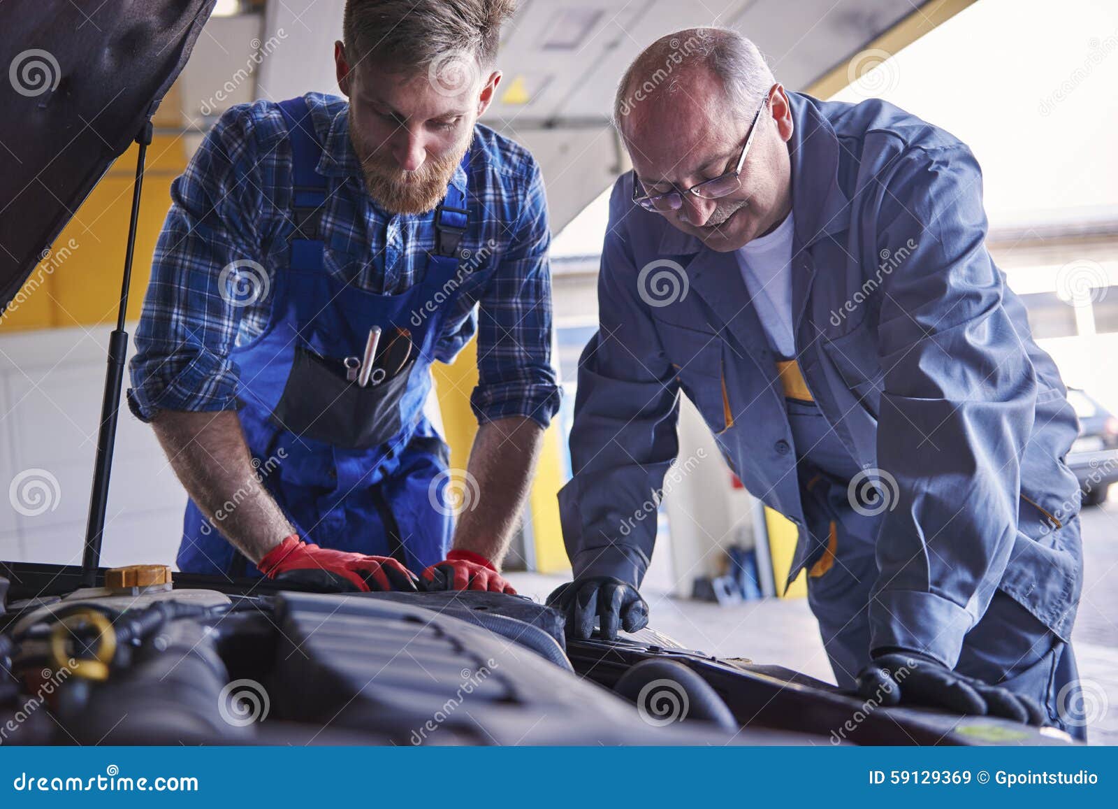 Car mechanics stock image. Image of partnership, examining - 59129369