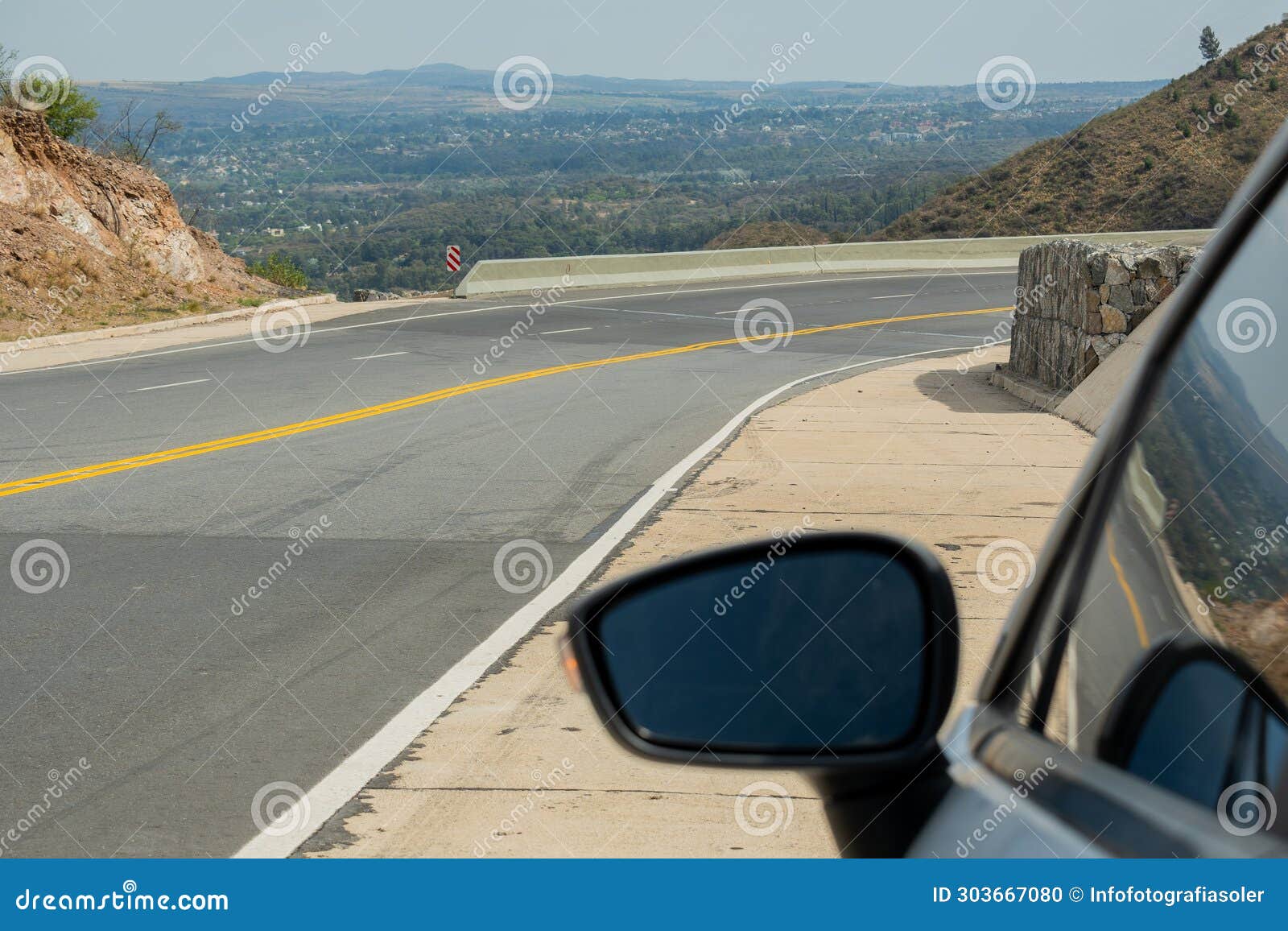Car Mirror on the Road with Sharp Focus on the Road. Stock Photo ...