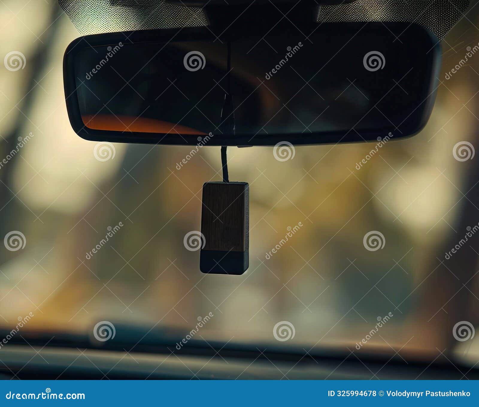 A Car Mirror with a Small Object Hanging from it Stock Photo - Image of ...
