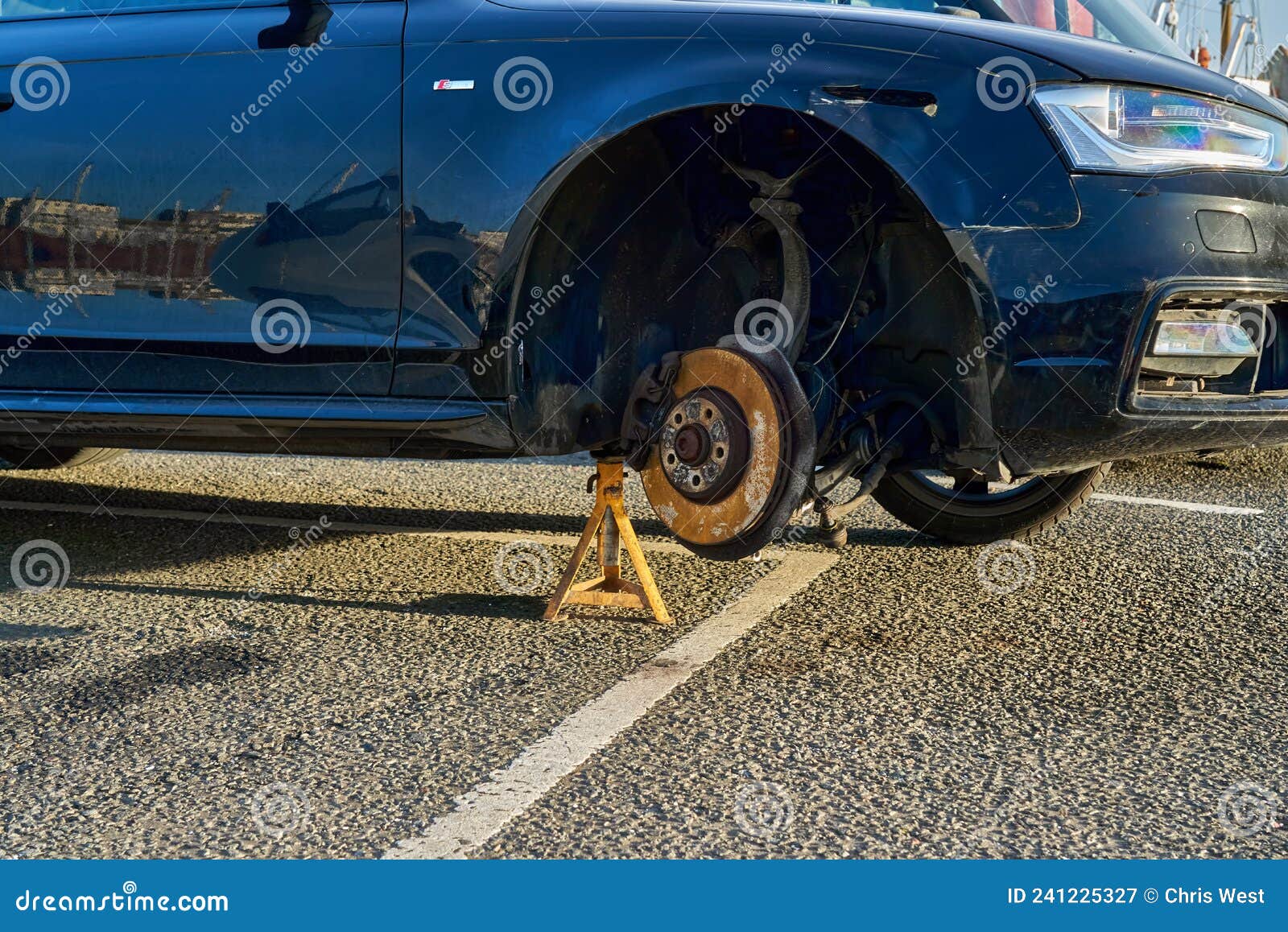 A car is missing a wheel stock image. Image of driving - 241225327