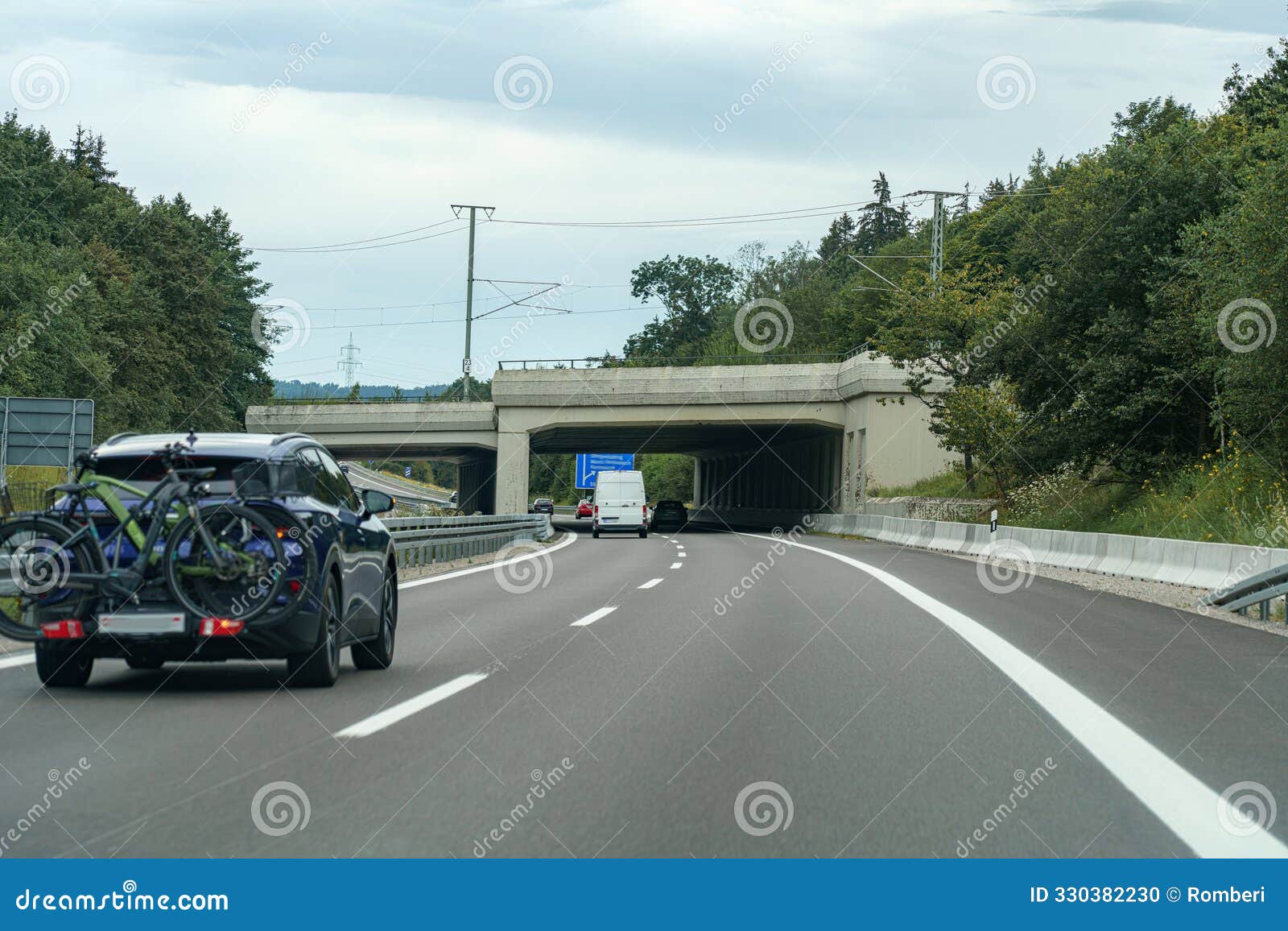 A Car on the Motorway Carries Bicycles in the Back of the Car Stock ...