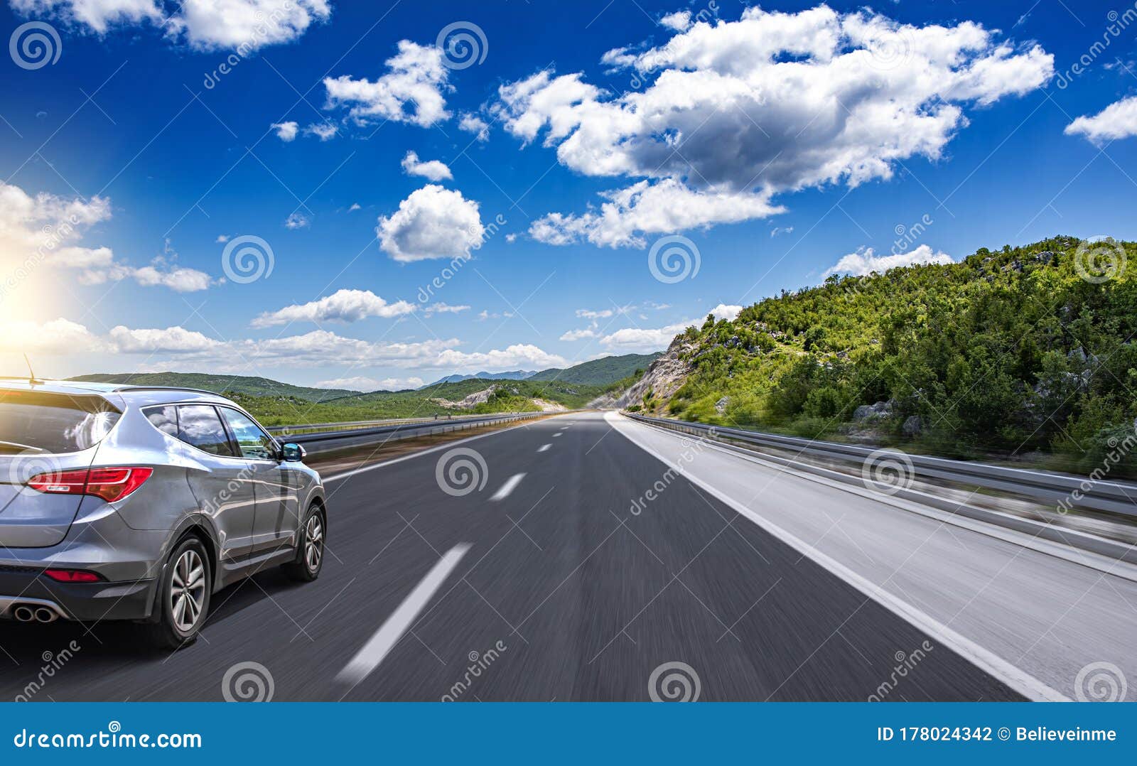 Car Moves on the Road among the Mountains and Forests. Stock Photo ...