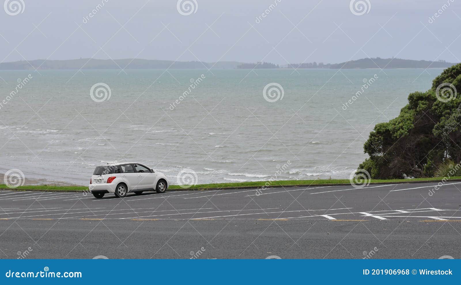 Car at Car Park with Ocean in Background on Cloudy Day Editorial Stock ...