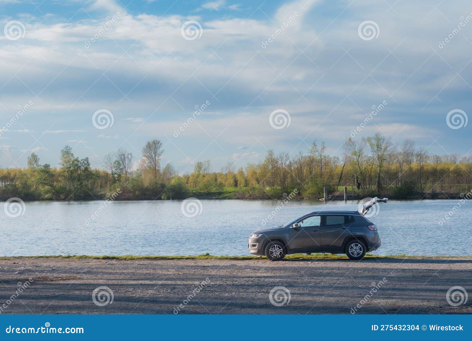 Car is Parked in a Scenic Location by a Lake, with the Trunk Open ...