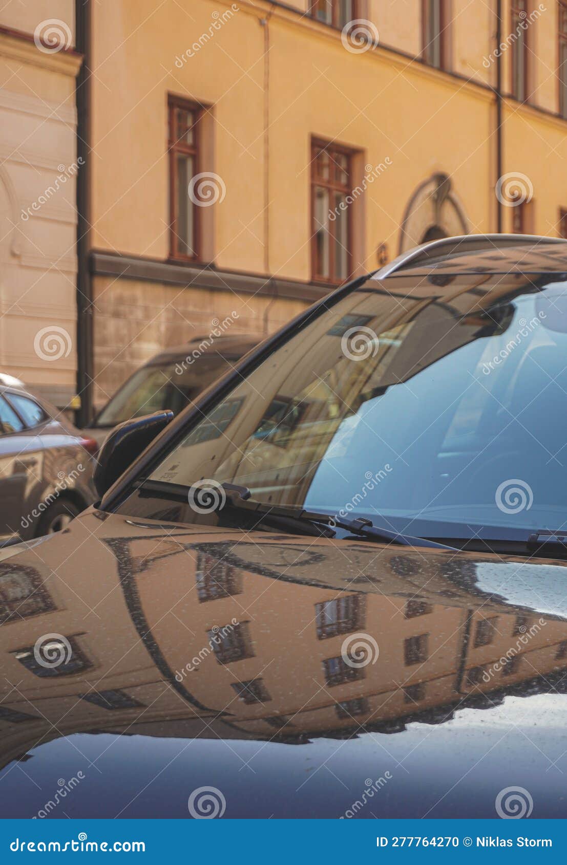 A Car Parked on the Side of a Building Stock Photo - Image of street ...