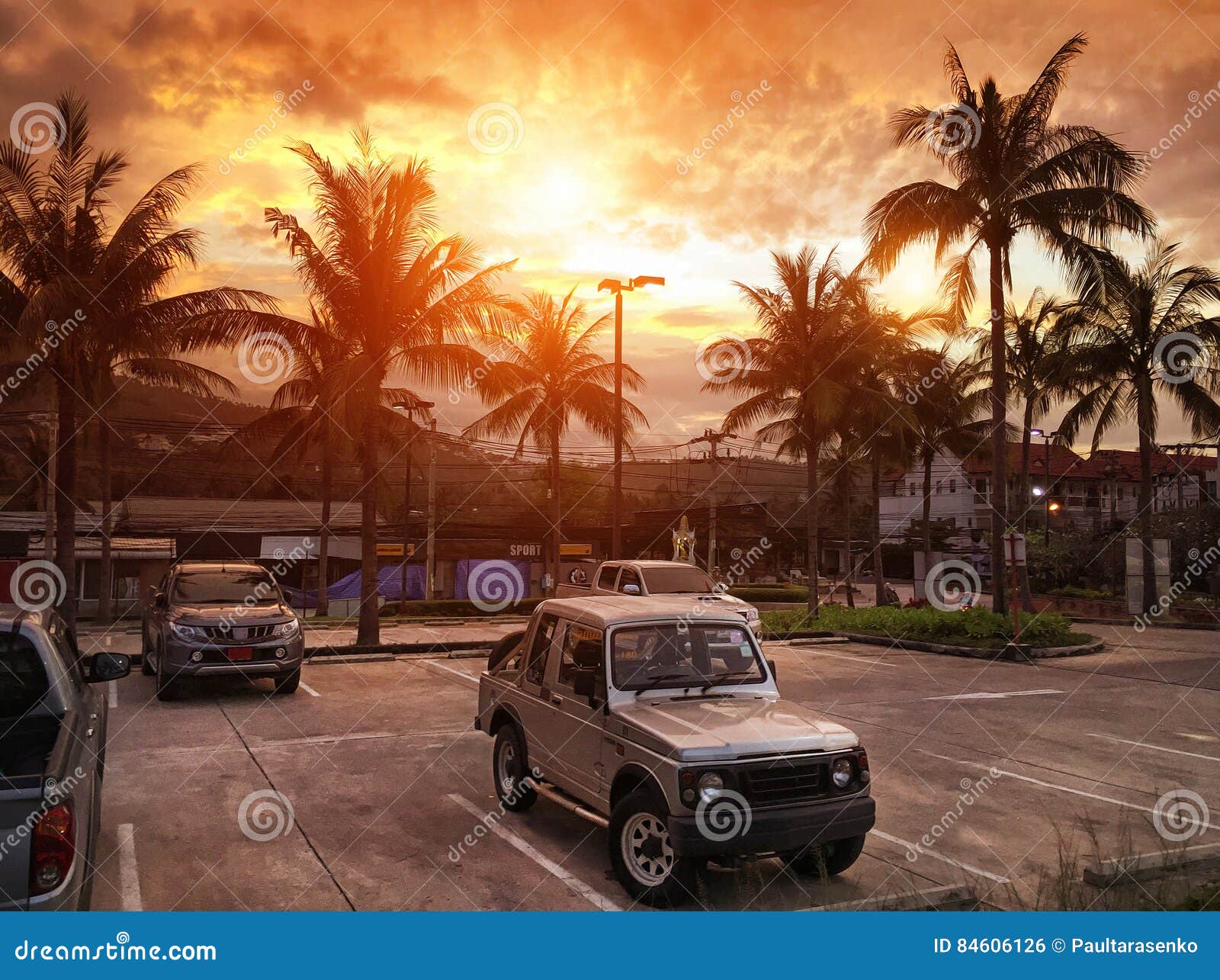 Car Parking with Cars and Empty Spaces at Sunset Stock Photo - Image of ...