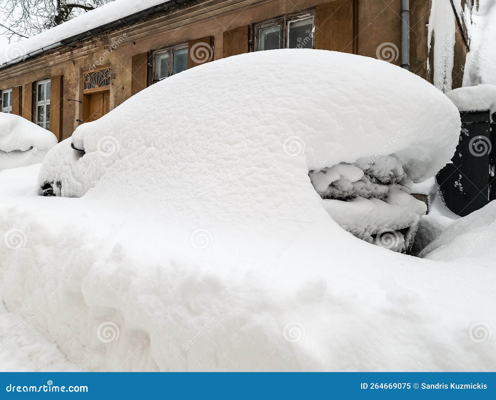 The Car in the Parking Lot is Completely Covered with Snow. Problems ...