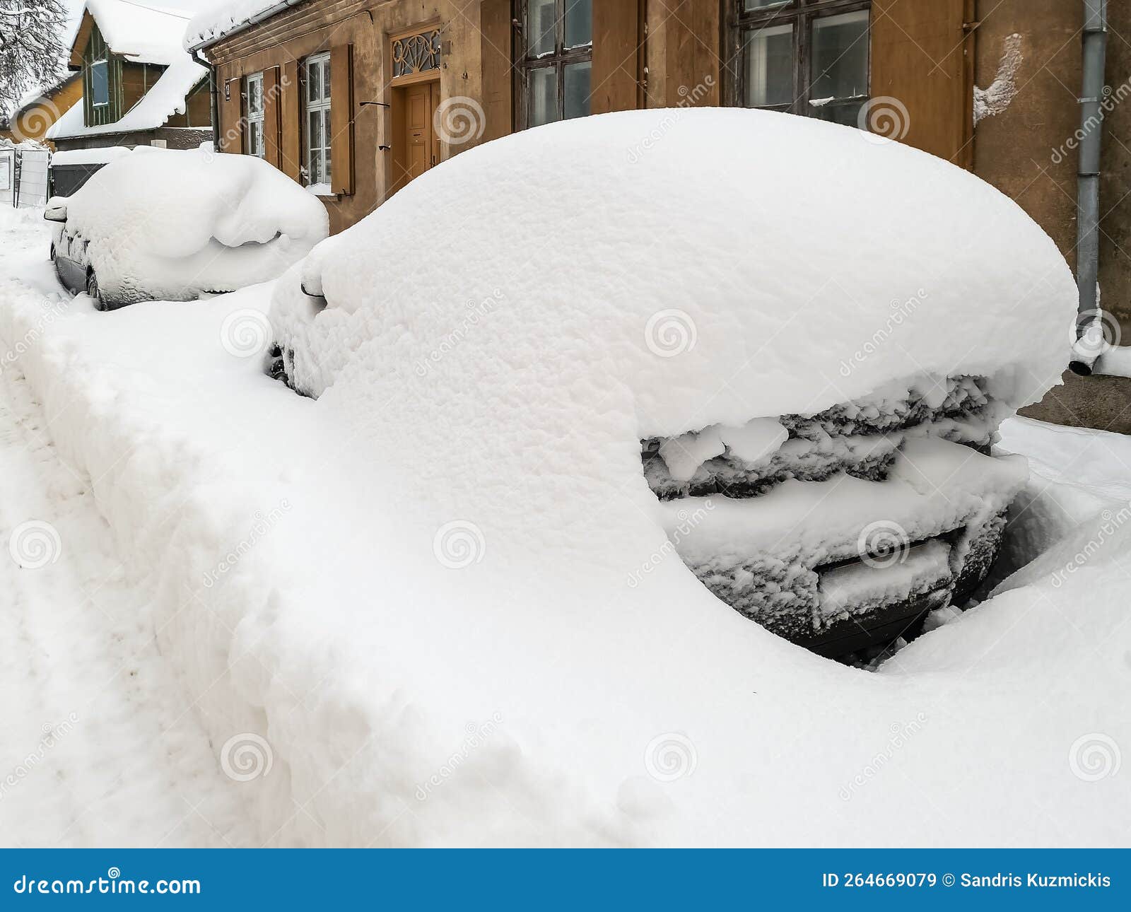 The Car in the Parking Lot is Completely Covered with Snow. Problems ...