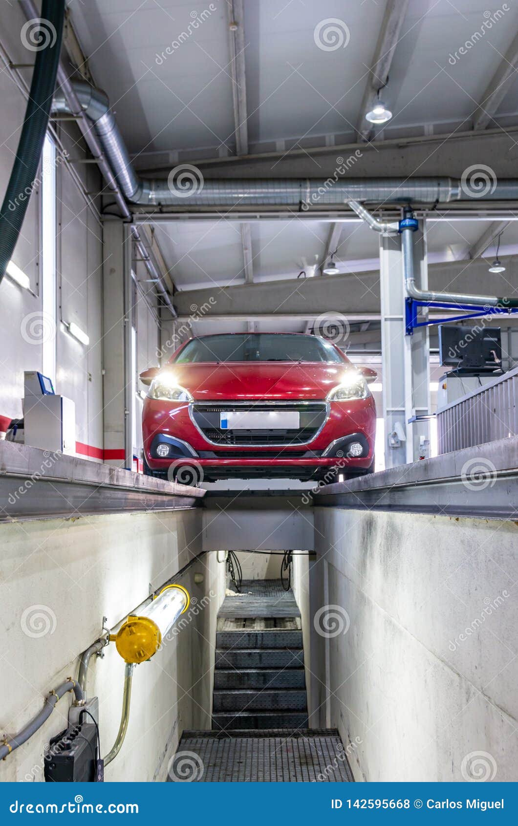 Car Passing Over the Inspection Pit Stock Photo - Image of front ...