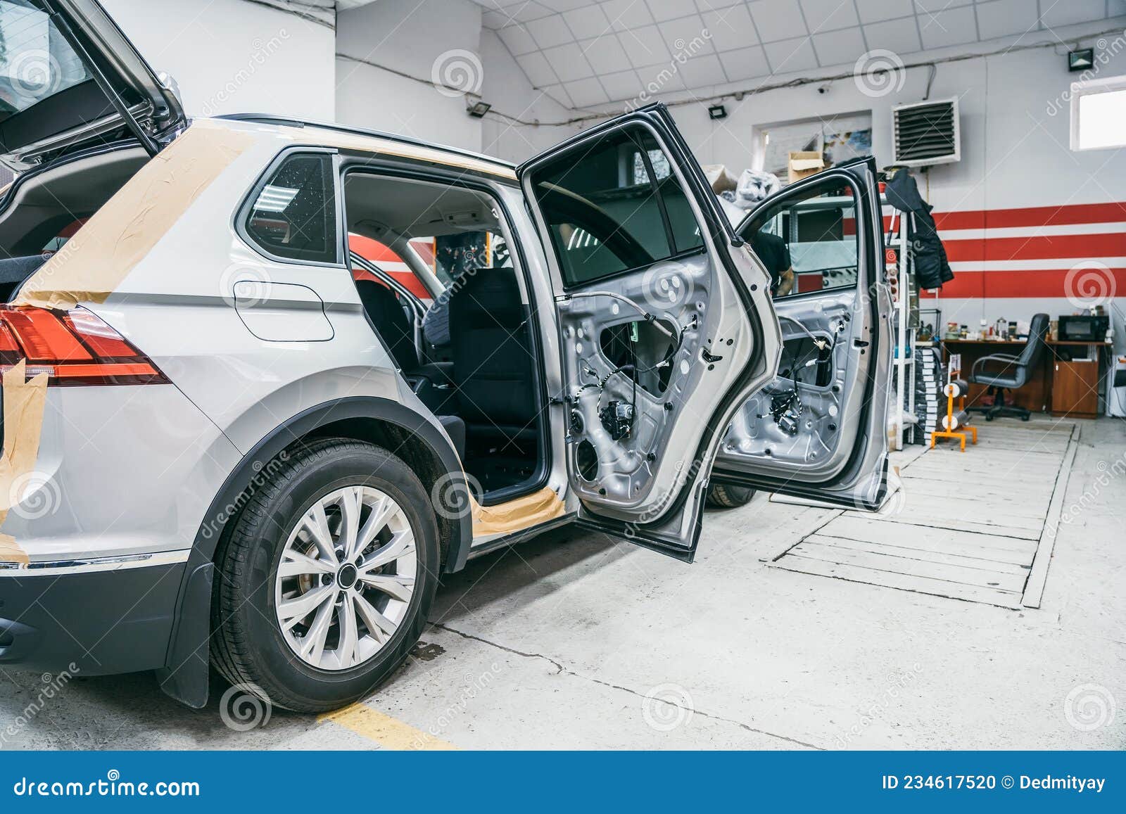 Car in Process of Installing Noise Insulation, Disassembled Doors ...