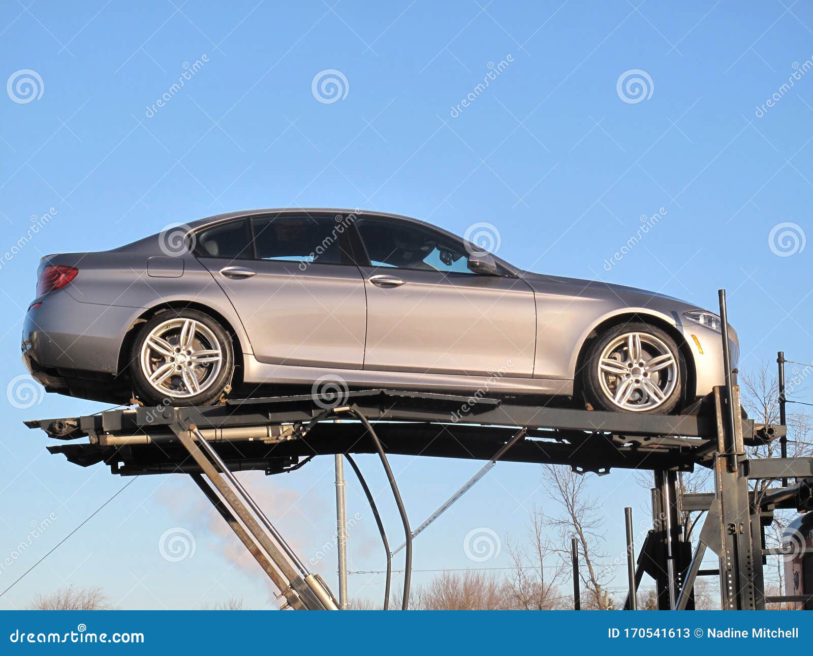 Grey Car Lifted High on a Platform Stock Image - Image of transport ...