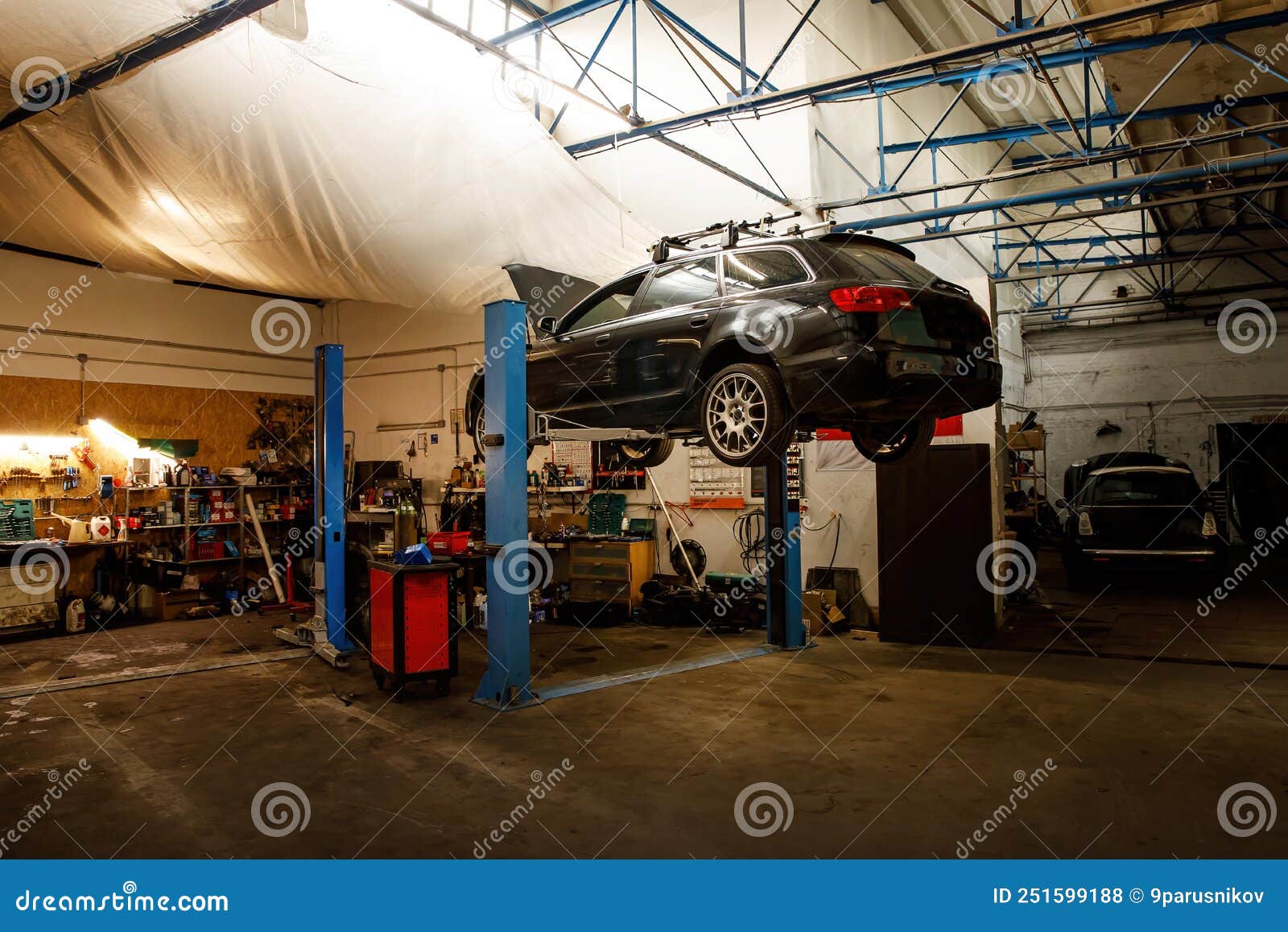 Car Raised on Car Lift at Auto Repair Service Stock Photo - Image of ...