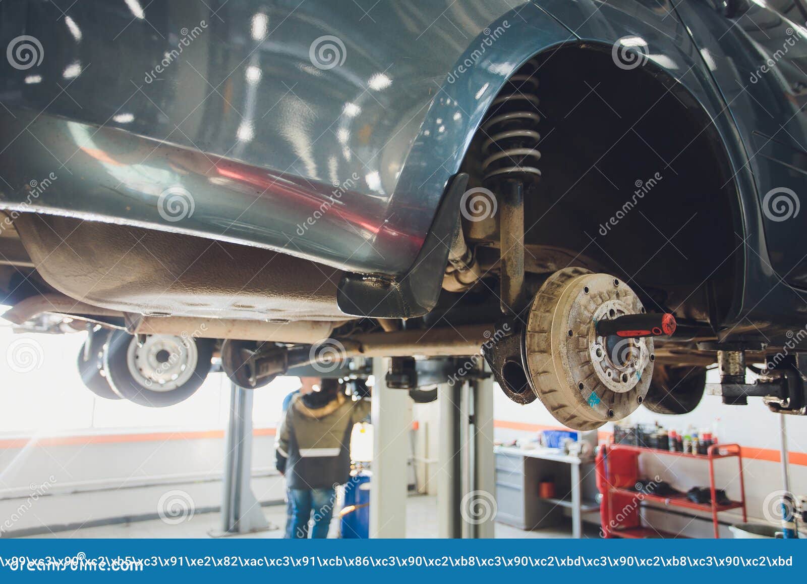 Car Raised on Car Lift in Autoservice. Stock Photo - Image of blur ...