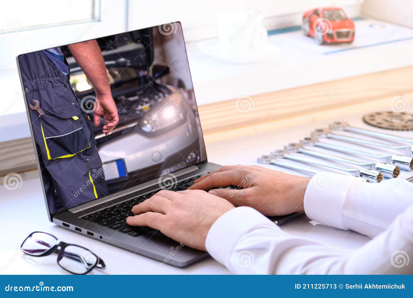 . Car Repair Courses. on the Table are a Computer and Tools for Car ...