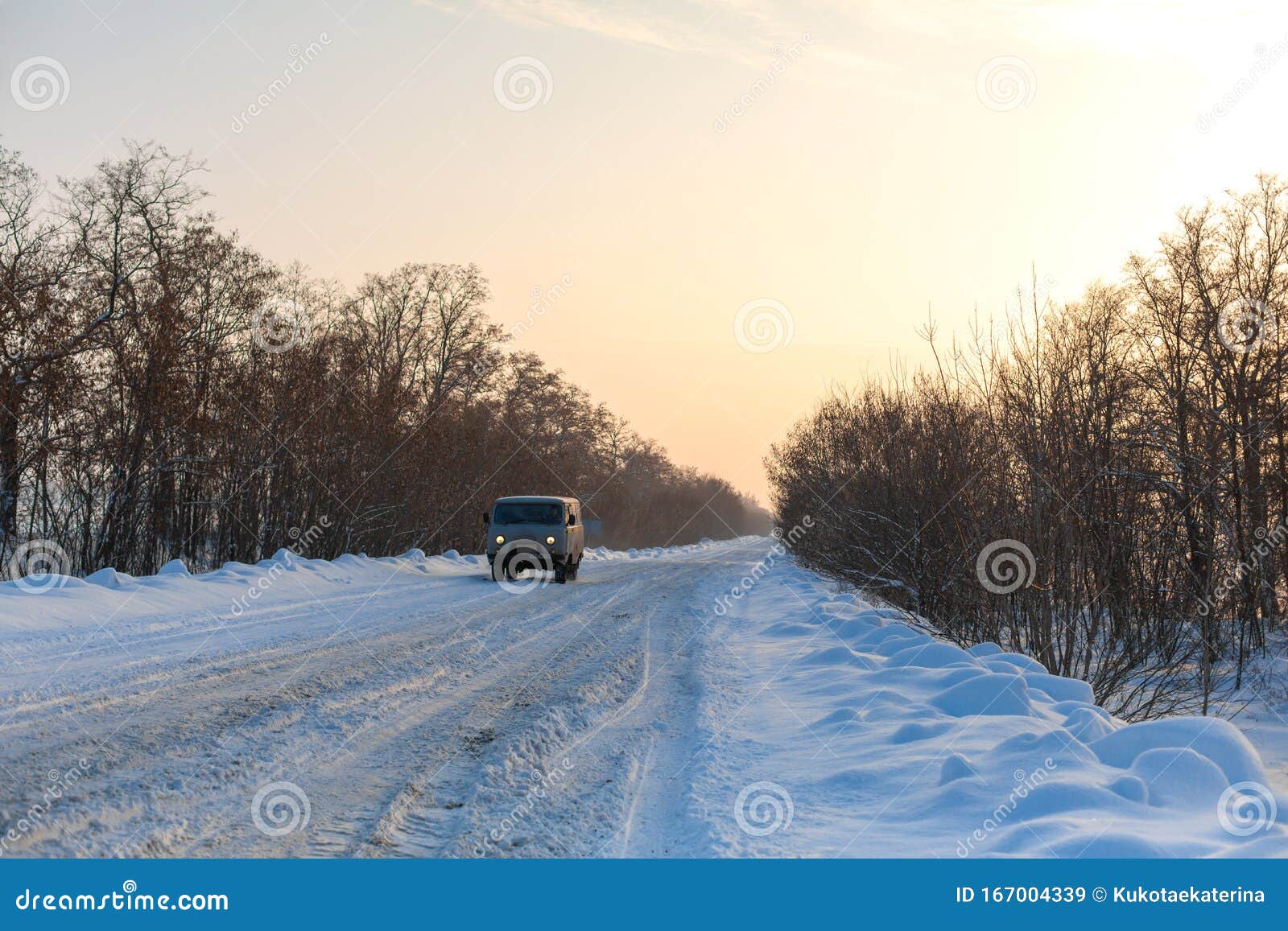 The Car Rides on a Snowy Highway. Difficult Weather Conditions ...