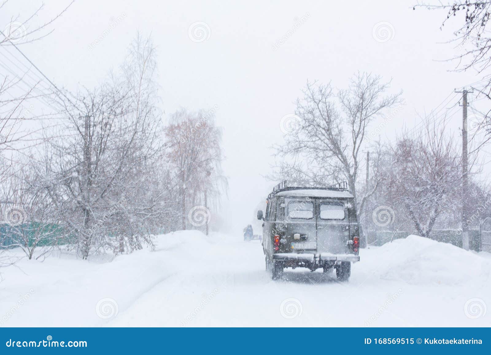 The Car Rides on a Snowy Highway. Difficult Weather Conditions Stock ...