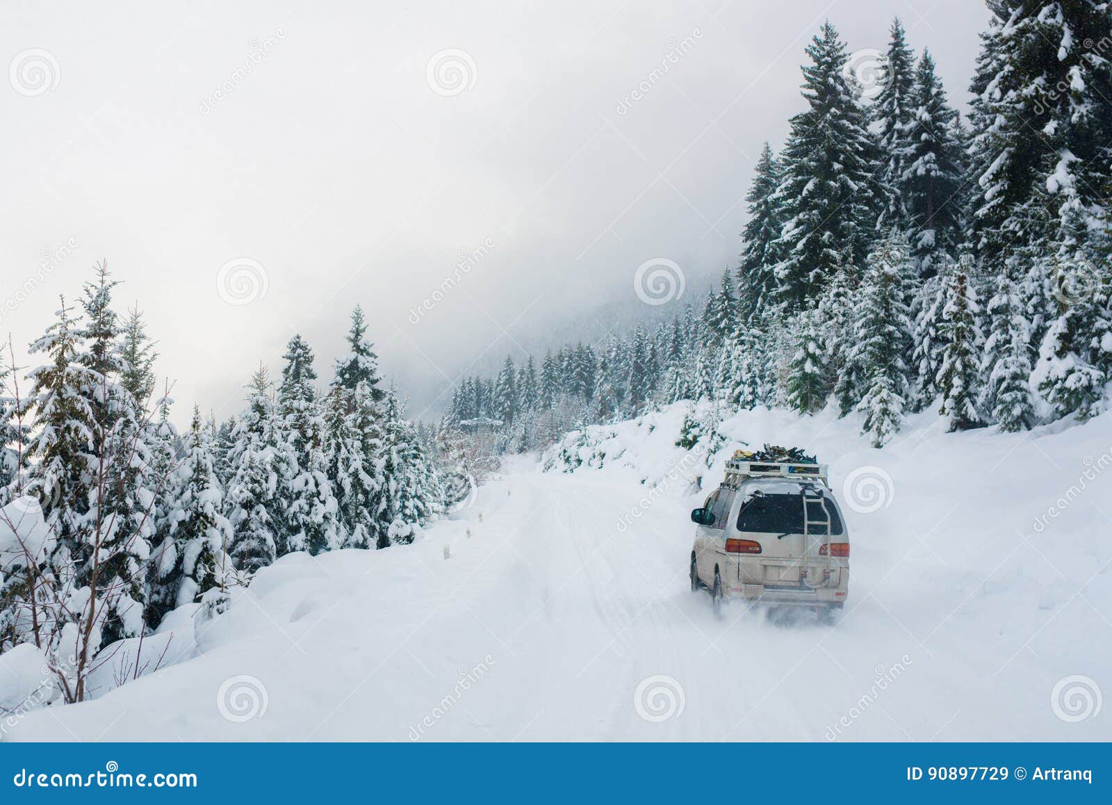 The Car is Riding on the Snow Road in the Mountains Stock Image - Image ...