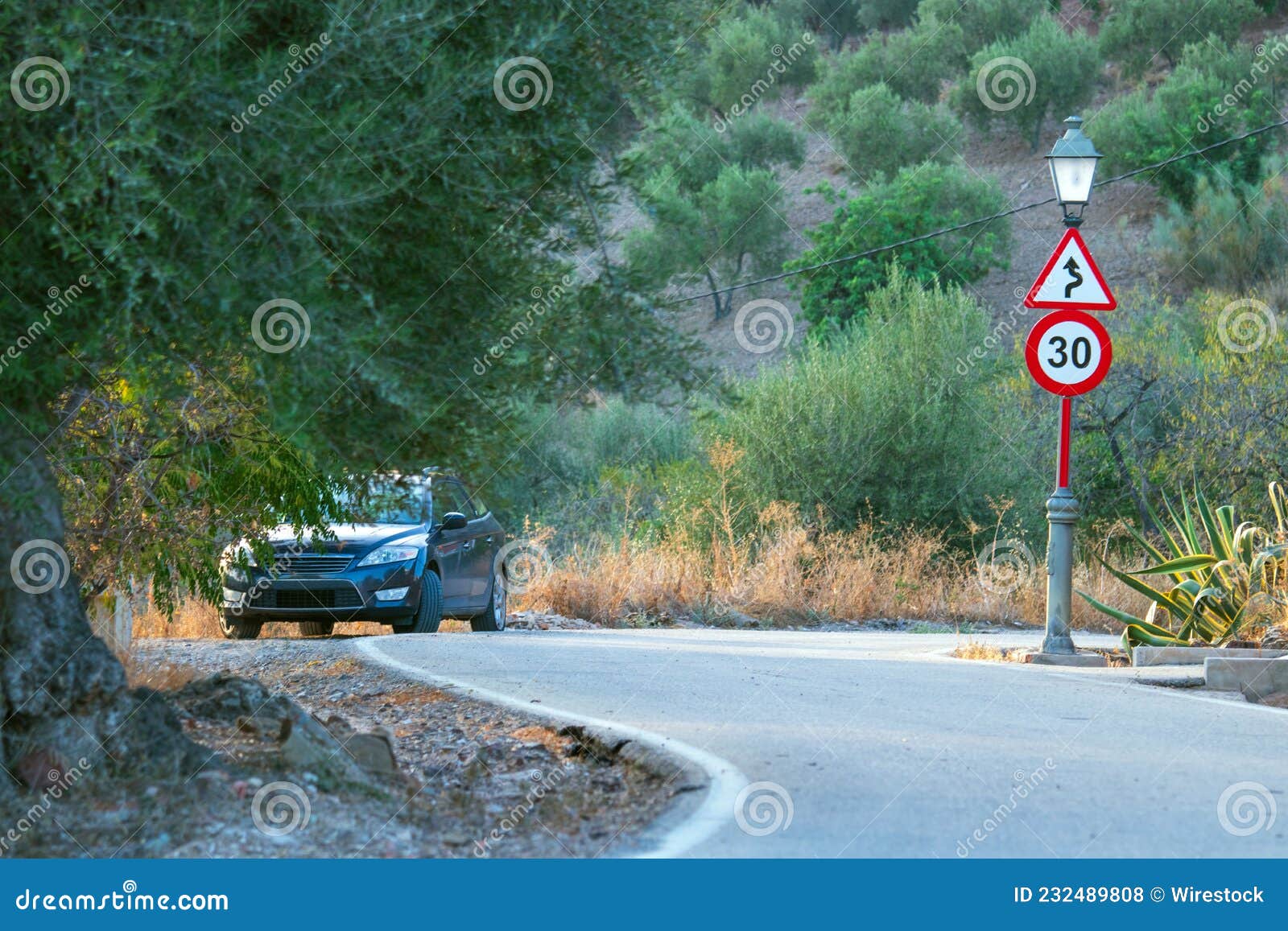 Car on a Road that Bends in Opposite Direction, Traffic Sign Stock ...