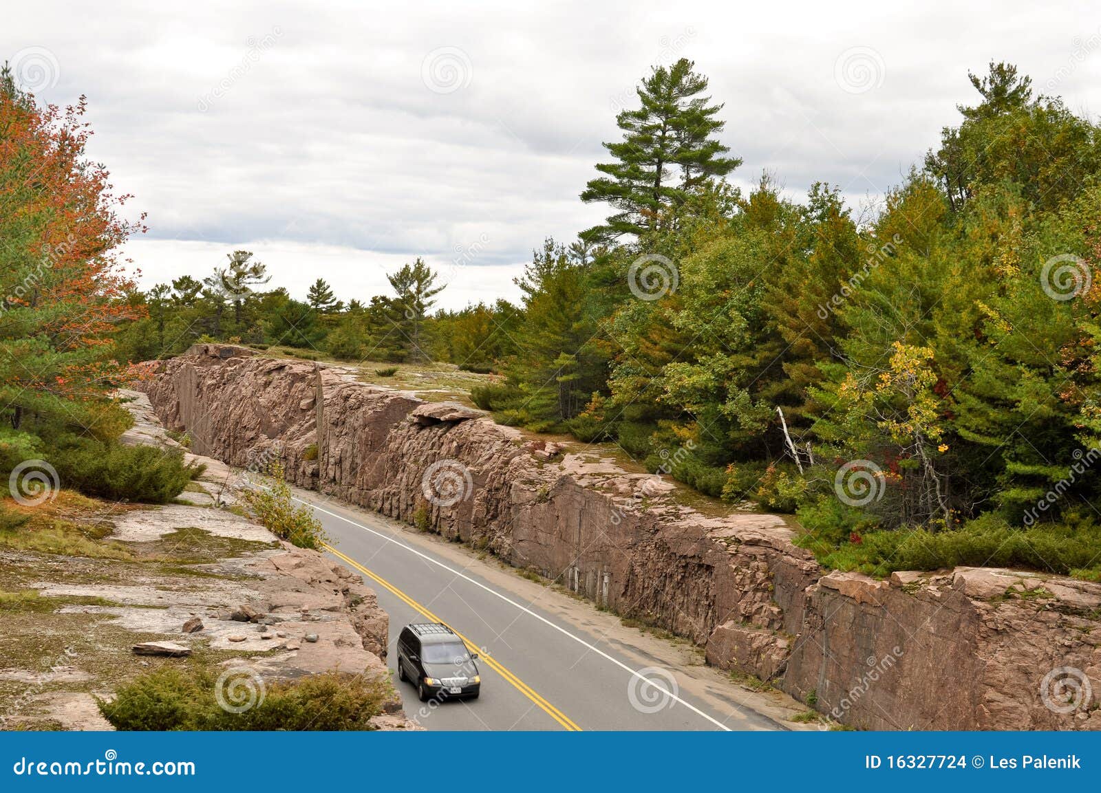 Car on a Road through a Rock Cut Stock Photo - Image of road, autumn ...