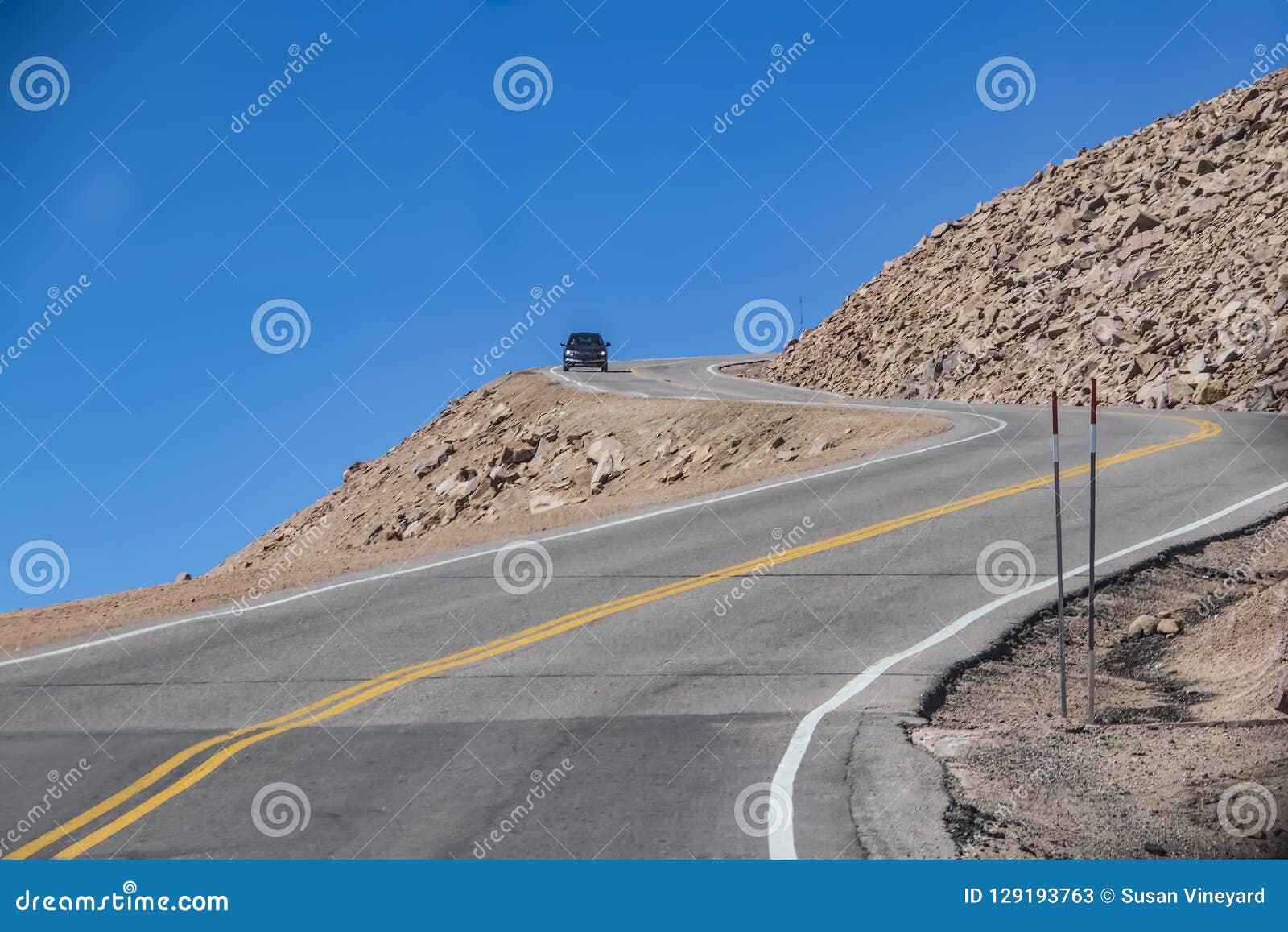 Car Rounding Sharp Bend with Steep Dropoff on Dangerous Mountain Road ...