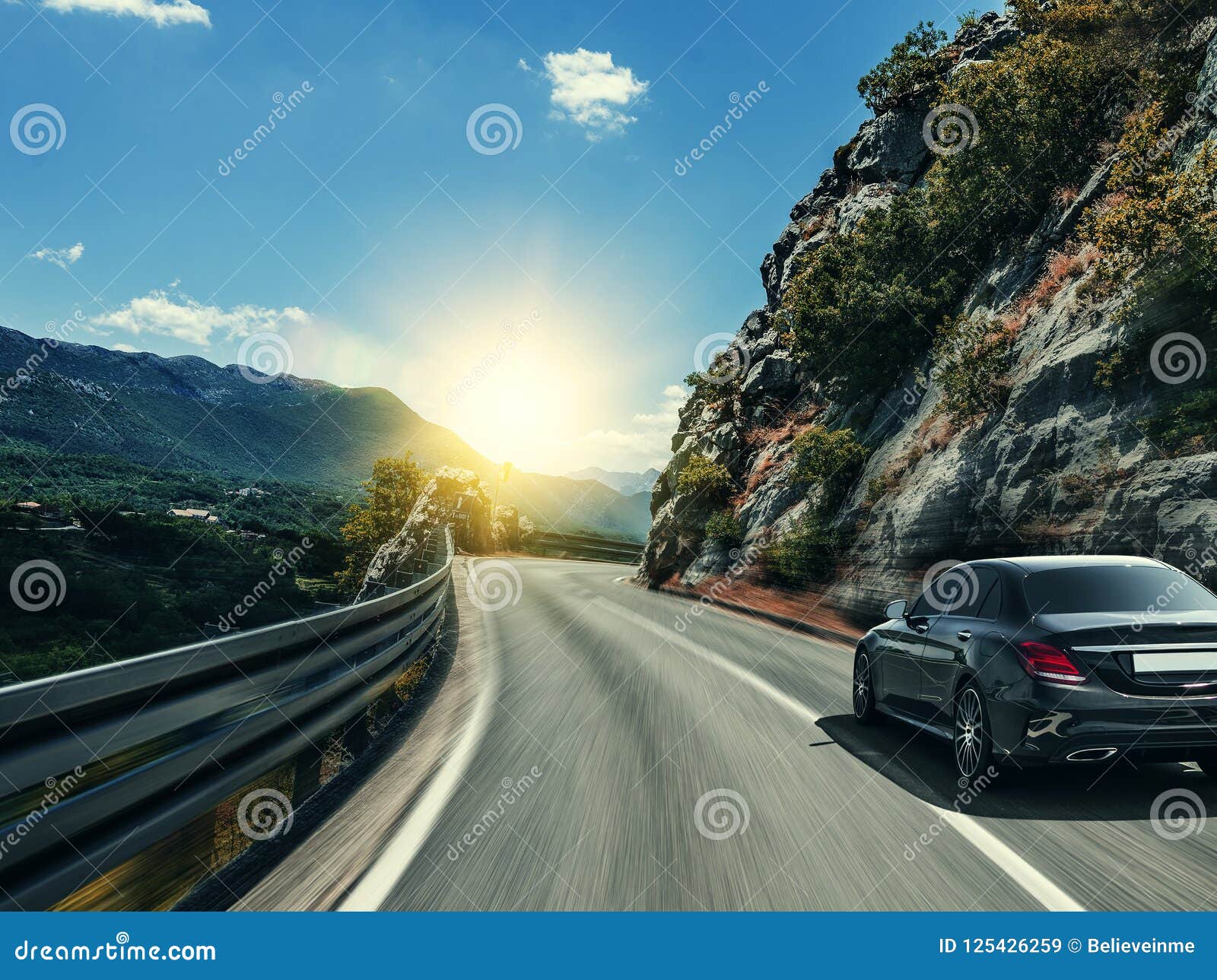 Black Car Rushing Along a High-speed Highway in the Sun. Stock Image ...