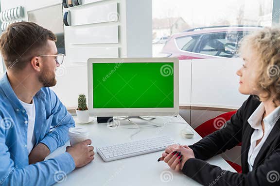 Car Sales Manager with Client at Computer in Dealership. Stock Photo ...