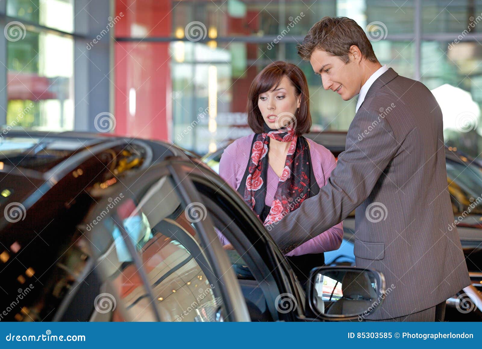 Car Salesman Explaining Car Features To Customer Stock Image - Image of ...