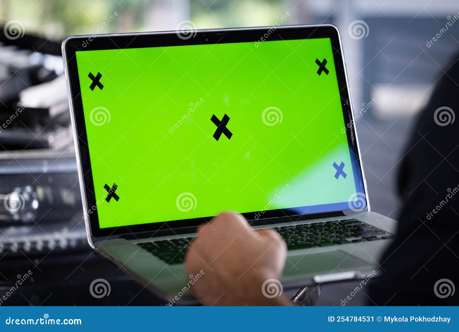 Car Service Mechanic Uses Laptop Computer with Green Screen Mock Up ...