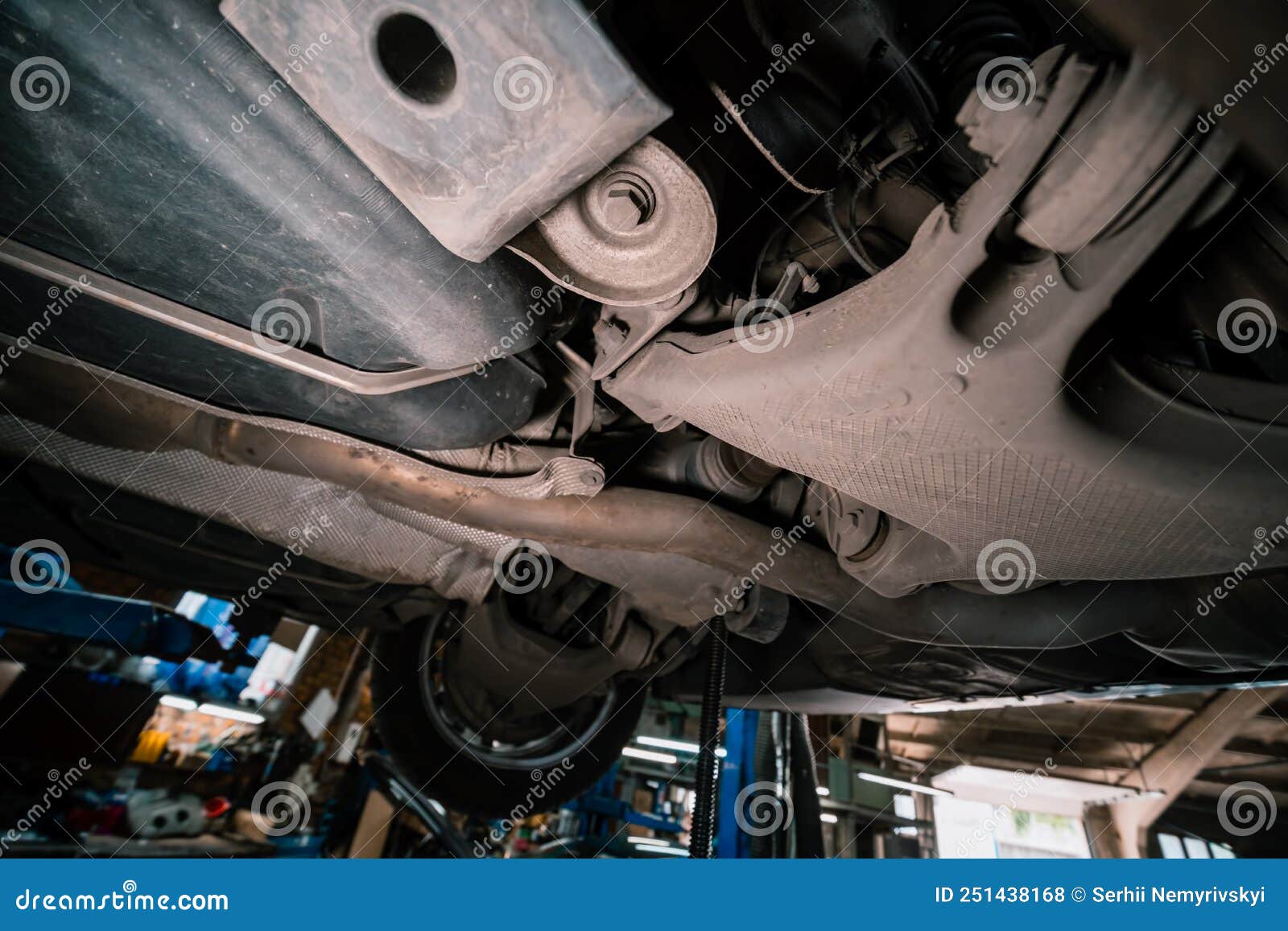 Car Service, Modern Car on a Lift. View of the Rear of the Car from ...