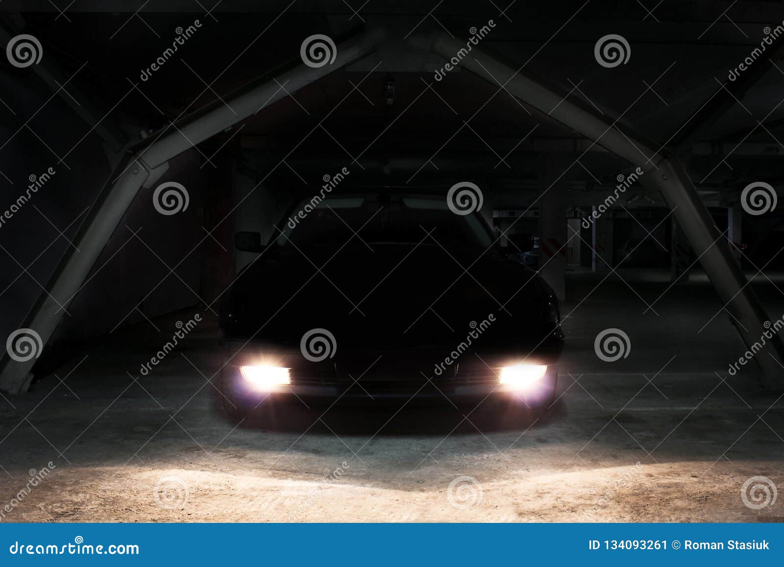 The Car in the Shadows with Glowing Lights in Low Light. Stock Image ...