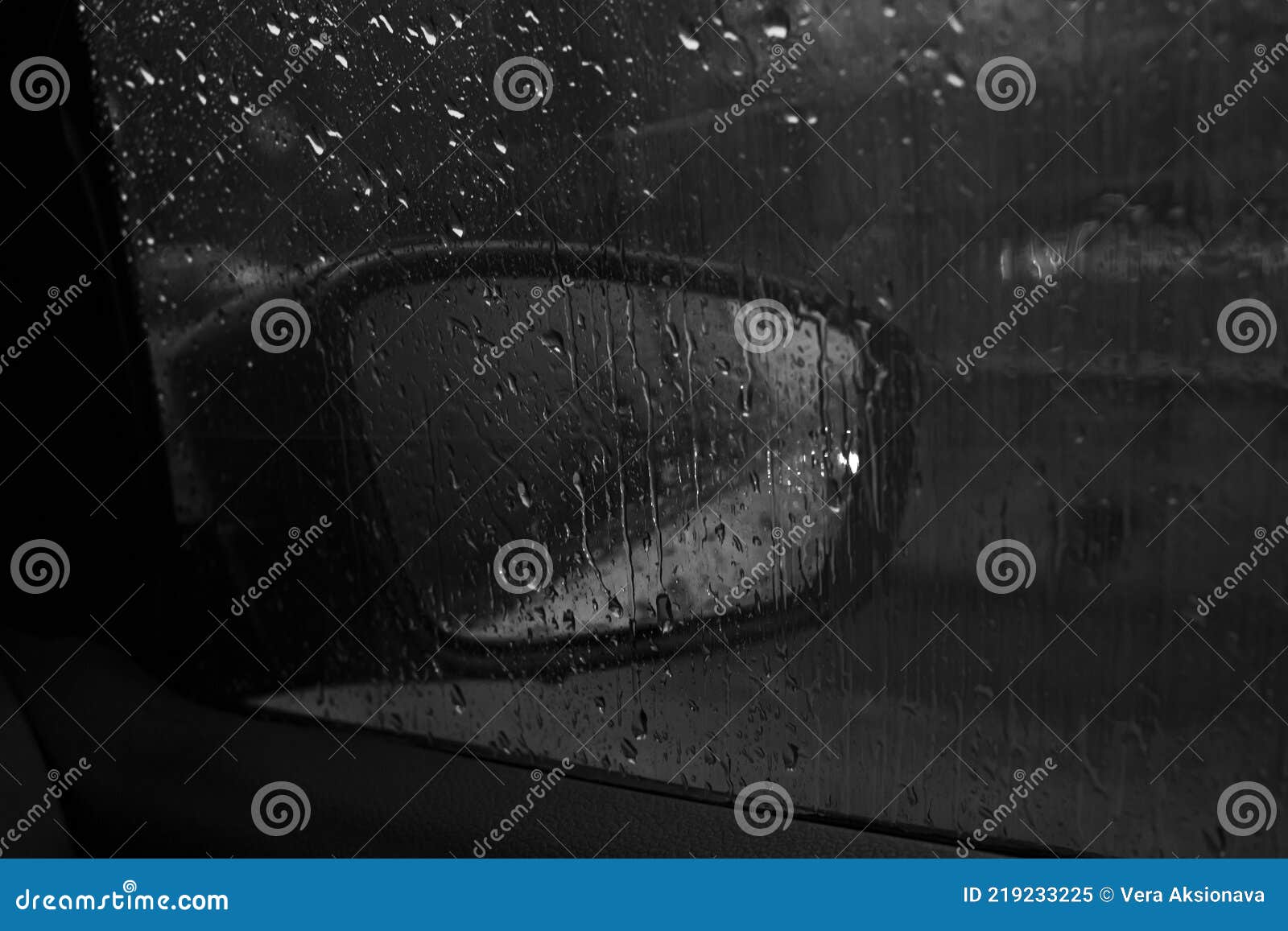 Car Side Mirror with Headlight Reflection in Rain Stock Image - Image ...