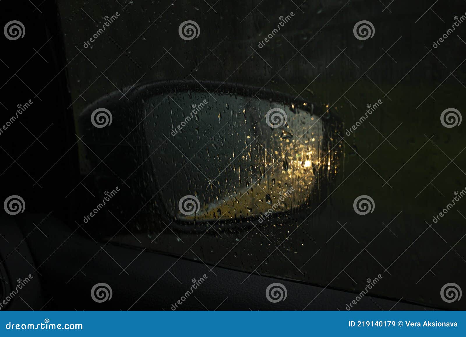 Car Side Mirror with Headlight Reflection in Rain Stock Image - Image ...