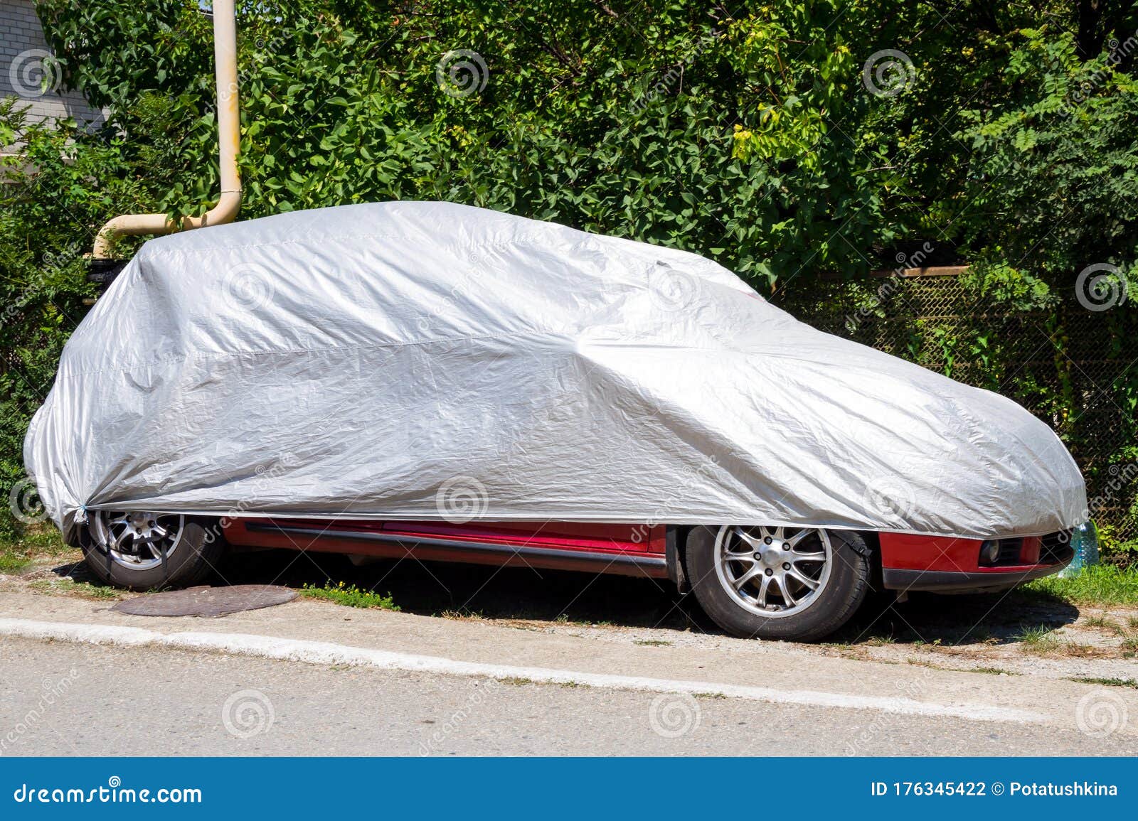 The Car is on the Side of the Road Under a Protective Cover Stock Photo ...