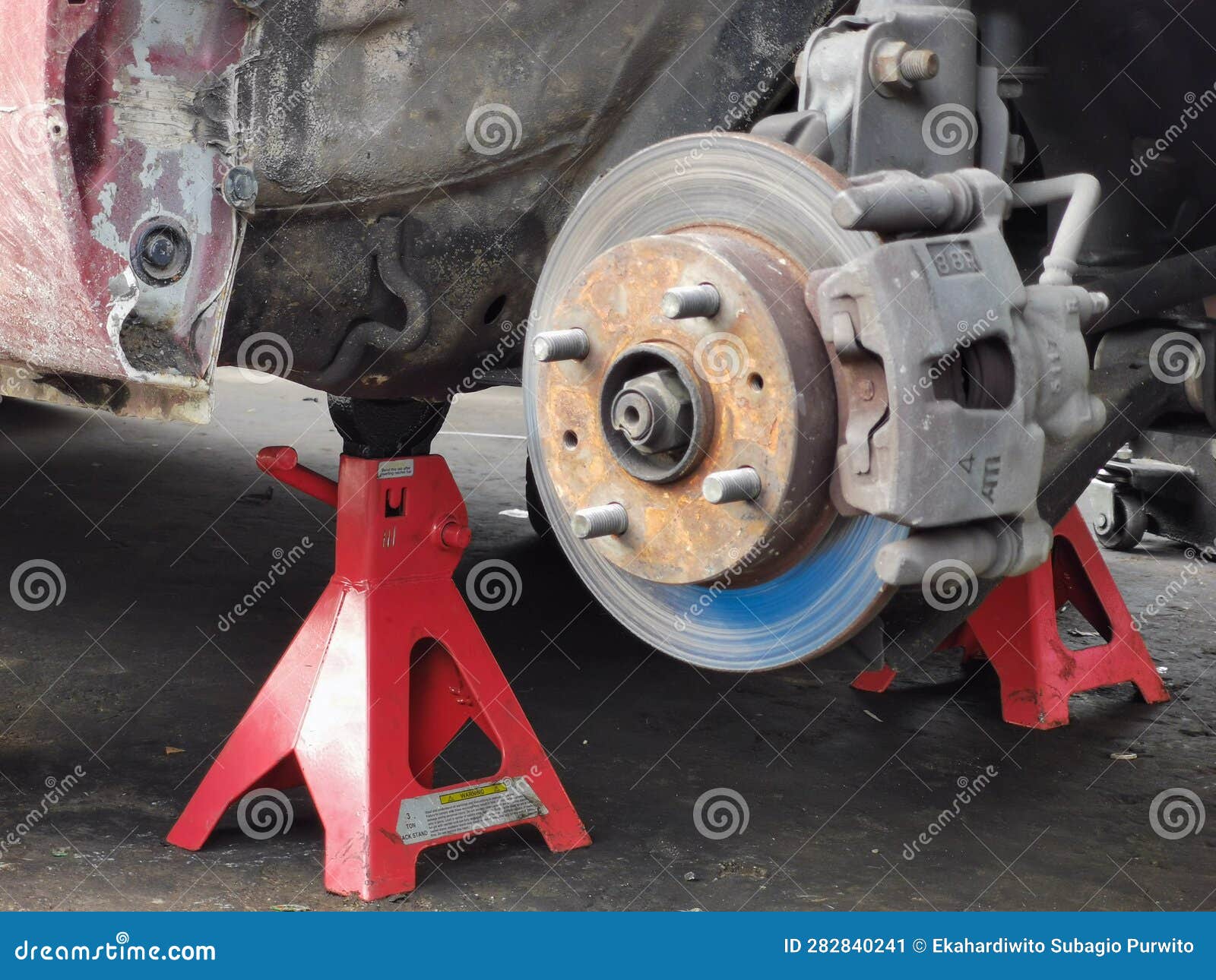 Car Sitting on Jack Stands in Local Car Station. Stock Image - Image of ...