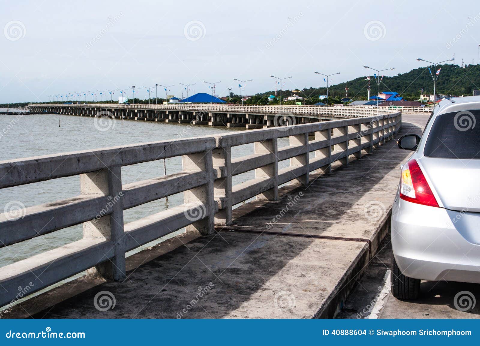 Car on Smooth Sea Concrete Bridge Stock Photo - Image of ocean, bunting ...