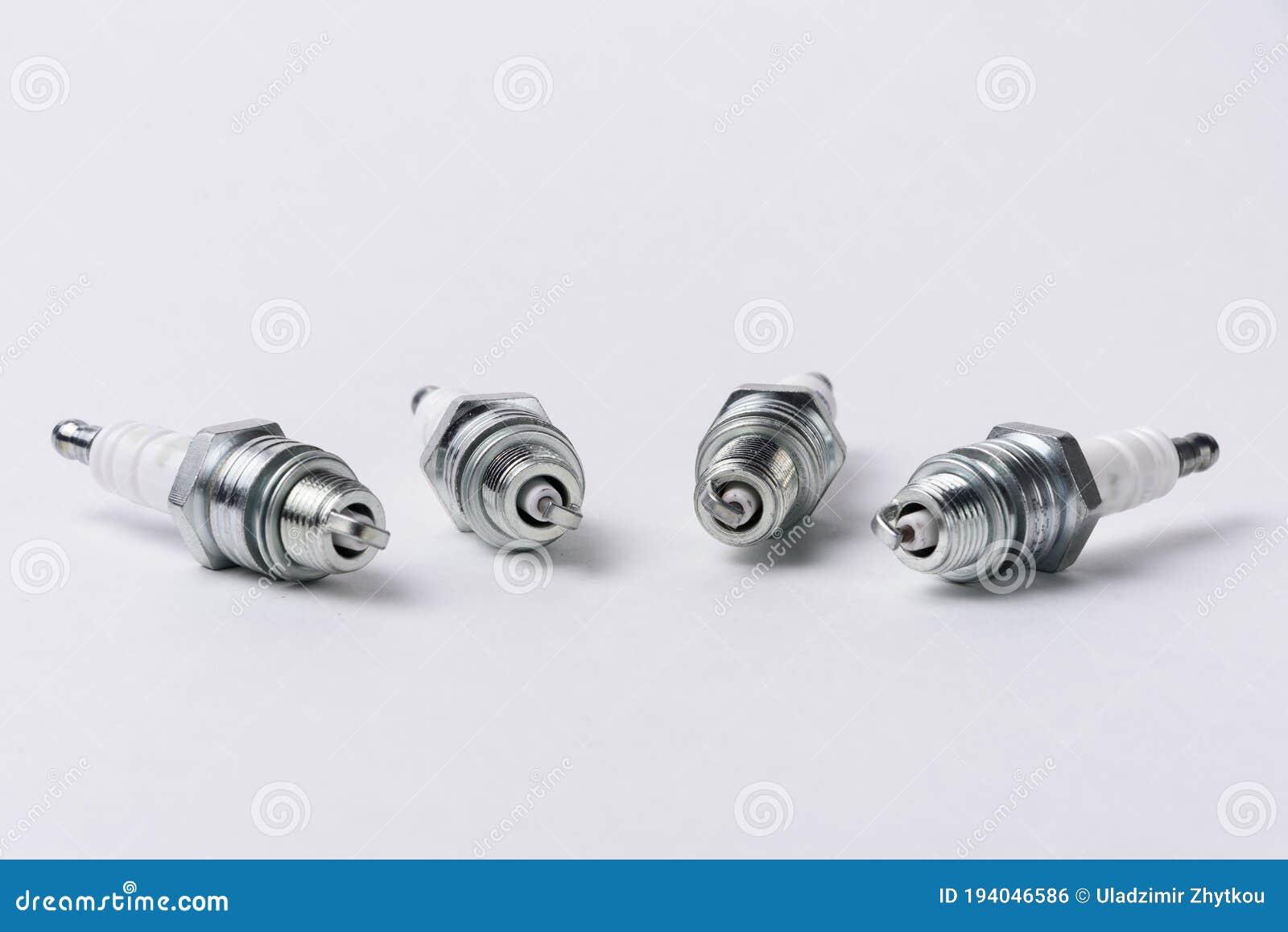 Car Spark Plugs on White Background. Car Spare Parts. Stock Photo ...