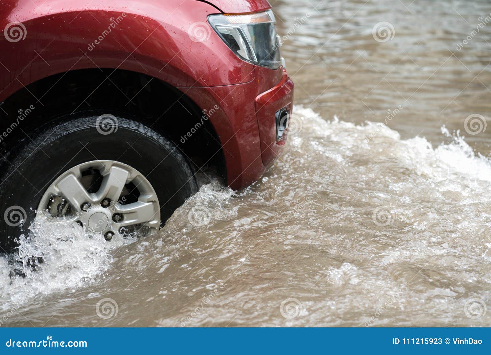 Car Splashes through a Large Puddle on a Flooded Street Stock Image ...