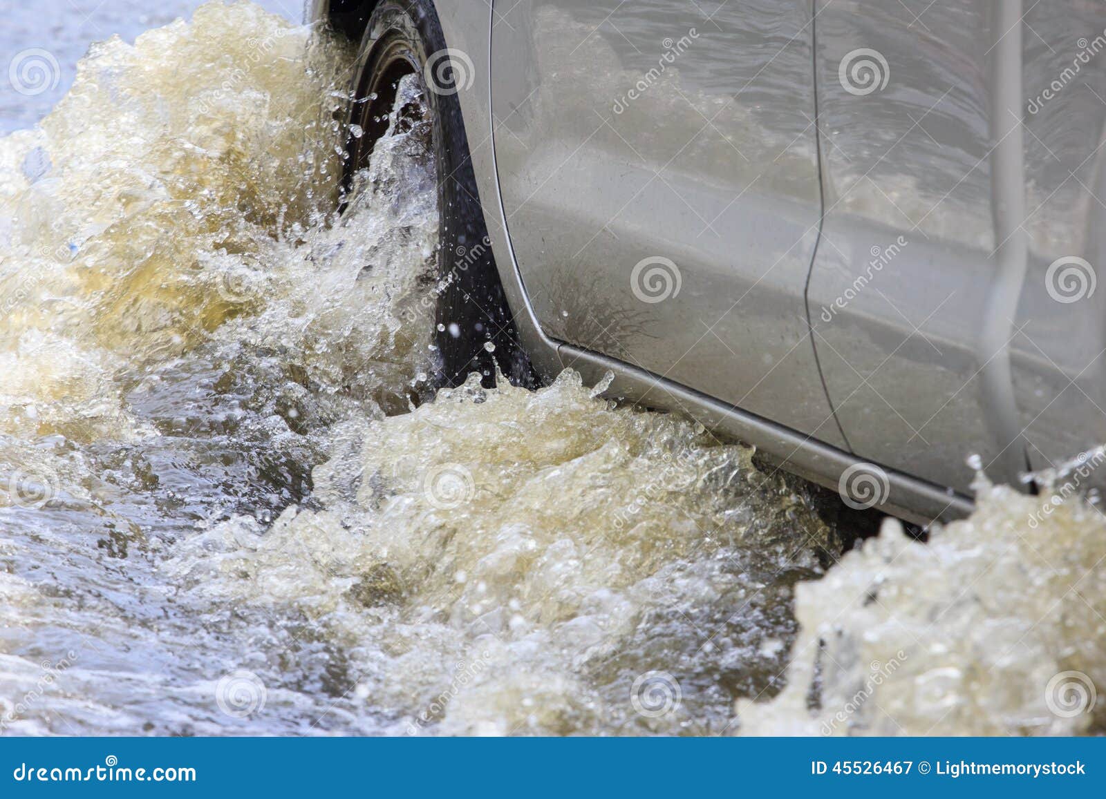 Car Splashes through a Large Puddle on a Flooded Stock Image - Image of ...
