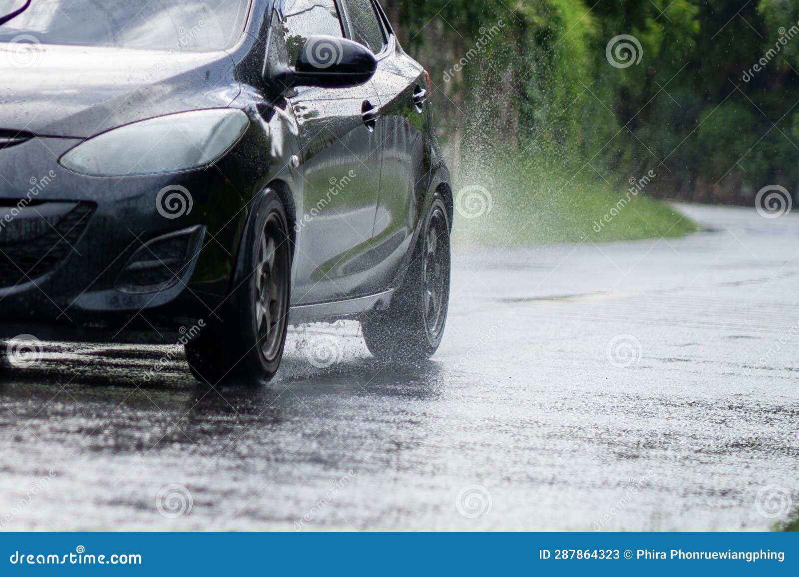 Car Splashes through Large Puddle on Flooded Street. Motion Car Stock ...