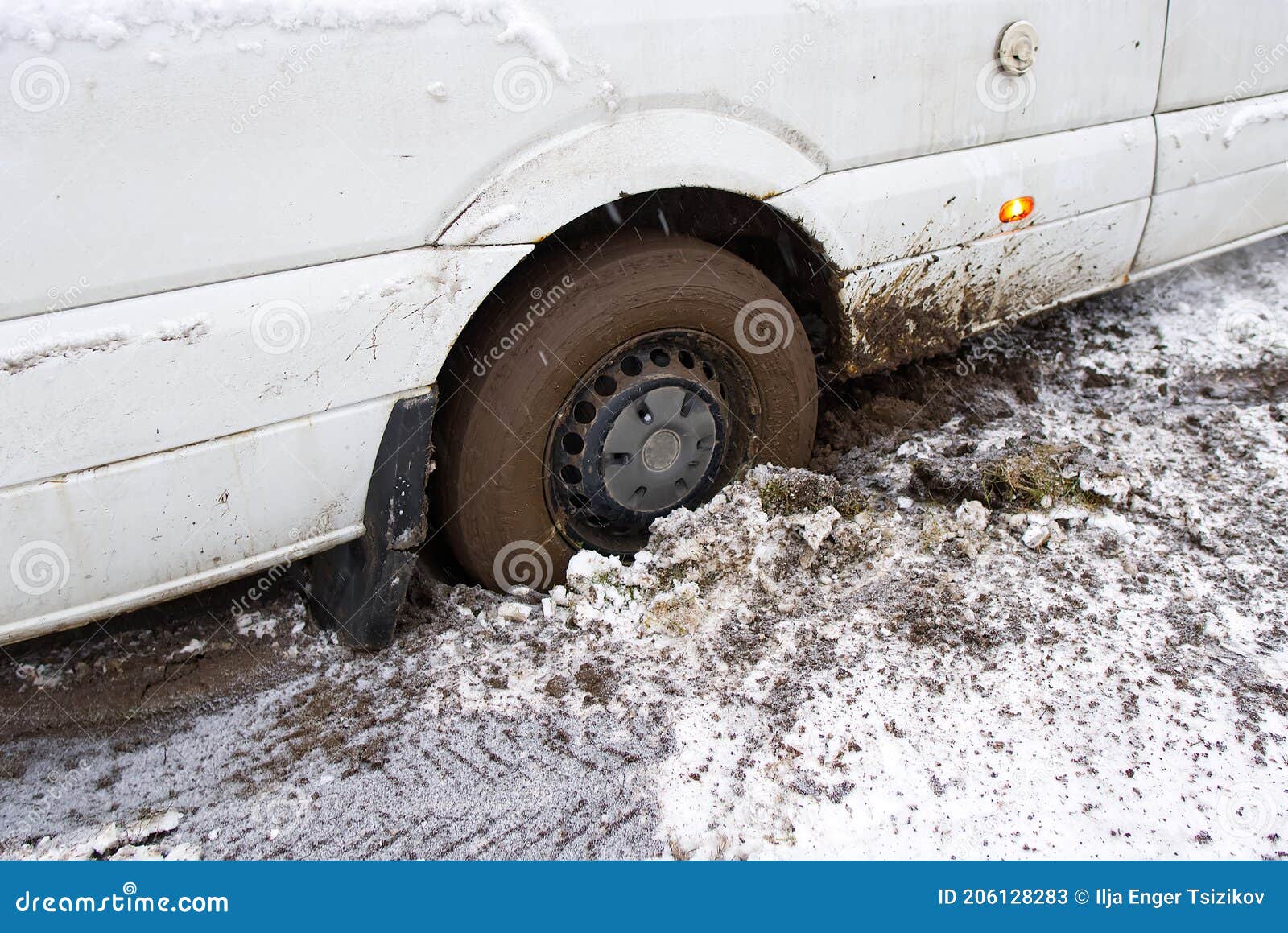 The Car Stalled in the Mud in Winter. Minivan Stalled in the Mud Stock ...