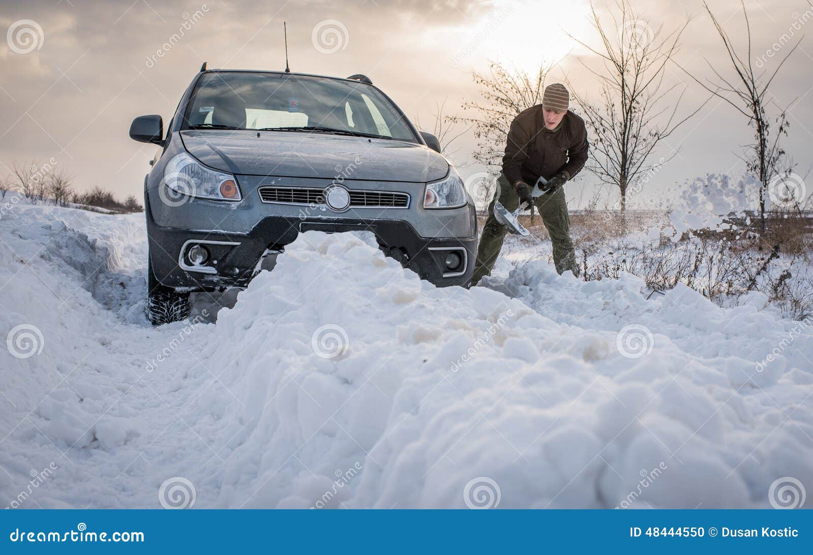 Car stuck in snow stock photo. Image of jacket, blizzard - 48444550
